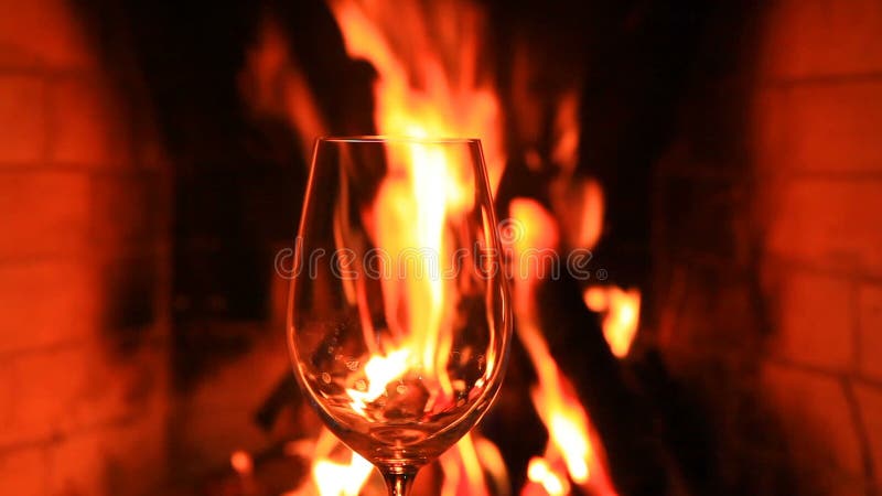 Empty Glass Against the Fire in the Fireplace Stock Video - Video of ...