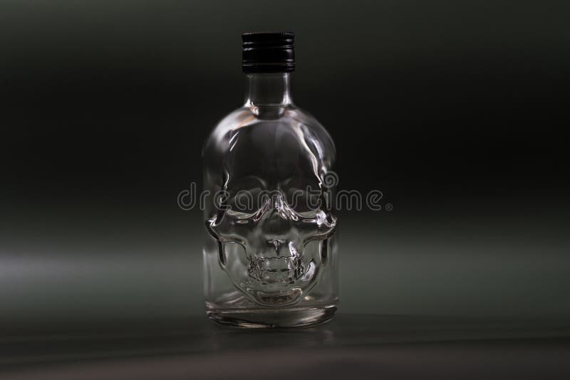 Empty Glass Bottle in the Shape of a Human Skull Stock Image - Image of ...