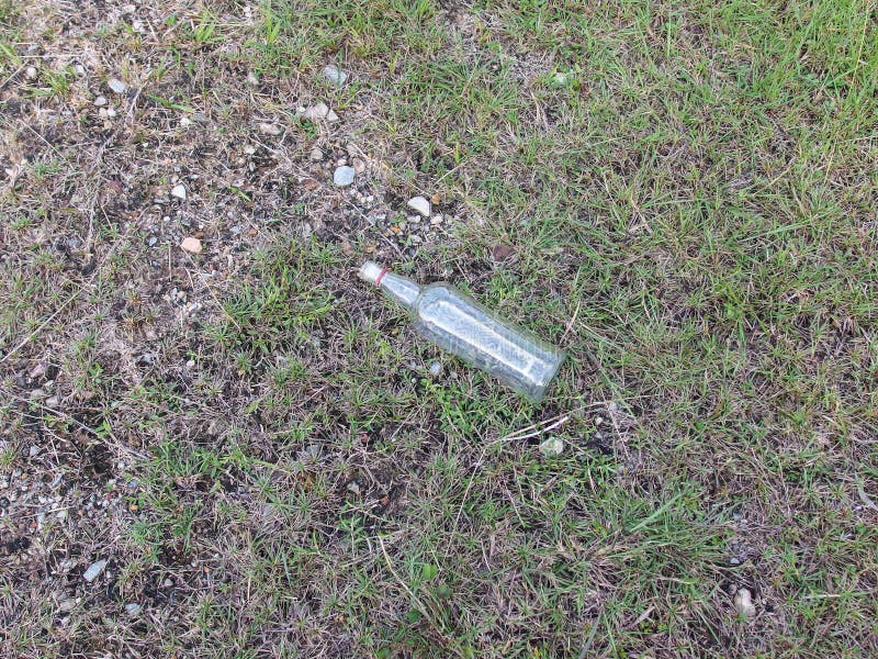 Empty glass bottle trash stock photo. Image of white - 114322228