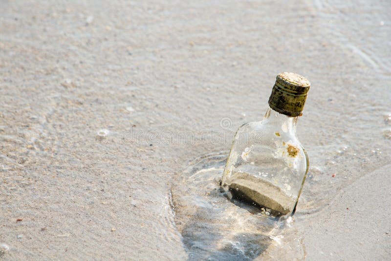 Empty Glass Bottle Washed Up As Rubbish on a Beach, Garbage on B Stock ...