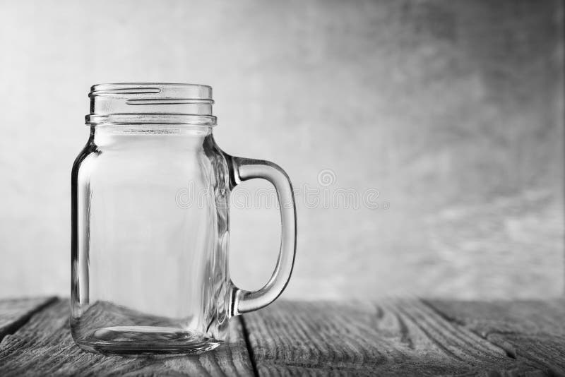 Empty Glass Jar with a Handle on a Wooden Table Stock Photo - Image of ...