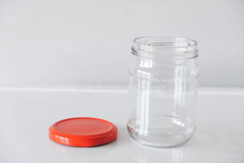Empty Glass Jar with Red Cover on White Table Background. Copy, Empty ...