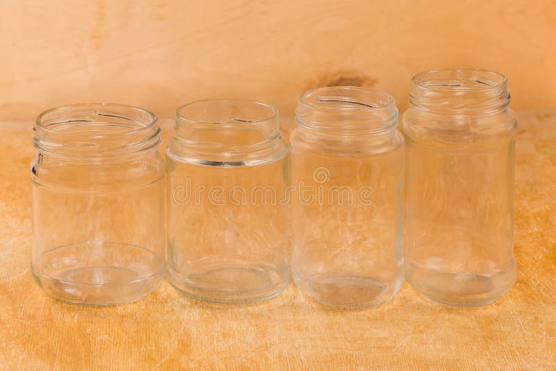 Empty Glass Jars Different Sizes on a Wooden Surface Stock Image ...