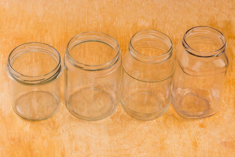 Empty Glass Jars Different Sizes on a Wooden Surface Stock Image ...