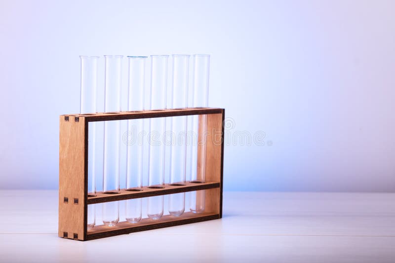 Empty Glass Test Tubes on a Wooden Stand on the Table. Empty Glass ...
