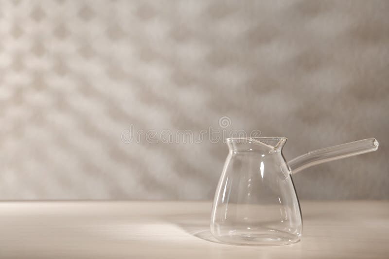 Empty Glass Turkish Coffee Pot on White Wooden Table. Space for Text ...