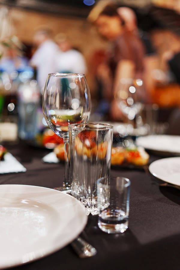 Empty Glasses and a Plate on a Served Banquet Table. Stock Image ...
