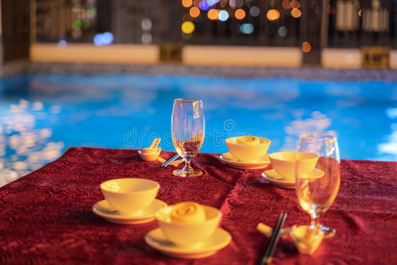 Empty Glasses on Table Prepared for Dinner Next To Swimming Pool at ...