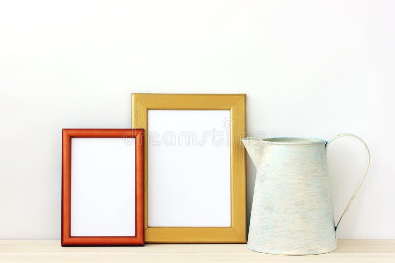 Empty Gold Photo Frames and Pitcher. Stock Photo - Image of wooden ...