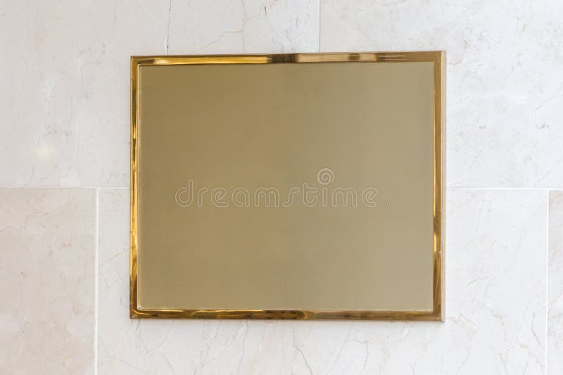 Empty Golden Frame and Plaque on Marble Wall for Your Design Stock ...