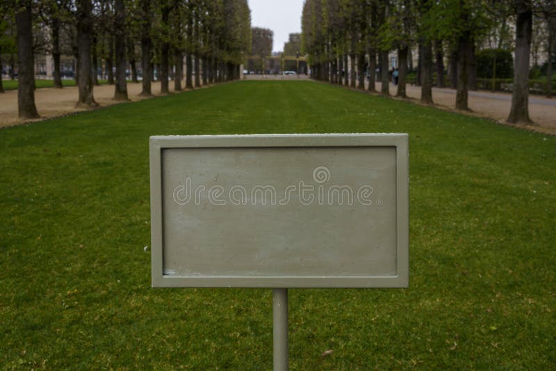 Empty Green Sign in Front of a Grass Field in Park Stock Image - Image ...