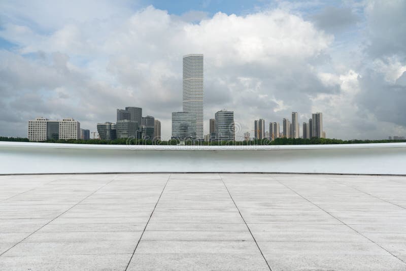 Empty Ground Floor with Modern Cityscape and Cloudy Sky. Stock Photo ...