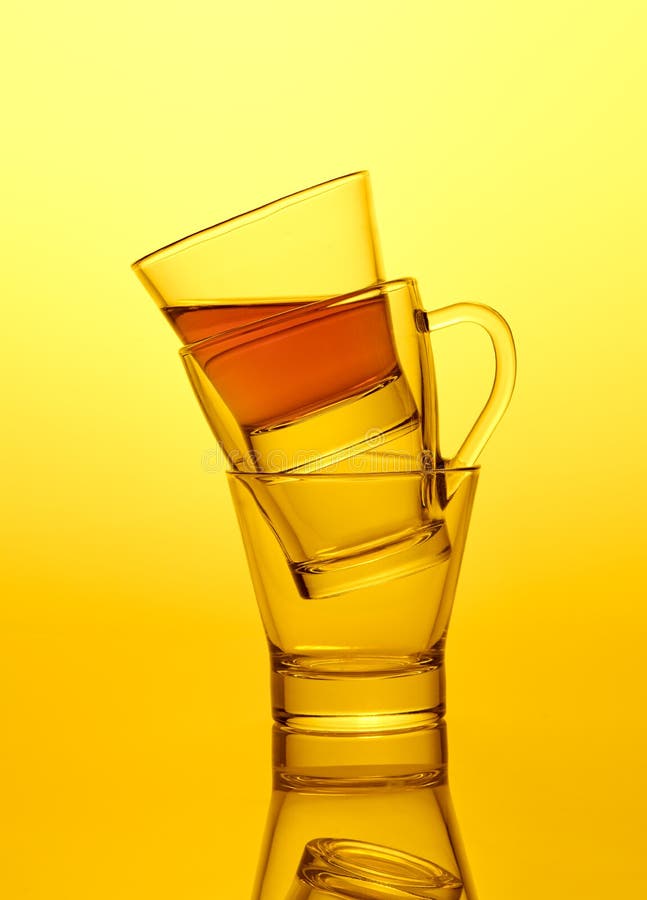 Empty and Half Full Double Glass Tea Cups Standing Like a Pyramid Stock ...