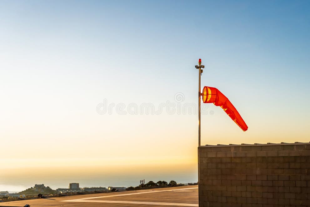Empty Helipad on Building Roof with Windsock Indicating Wind Direction ...