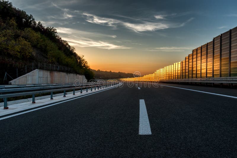Empty highway at sunset stock image. Image of nature - 105300665