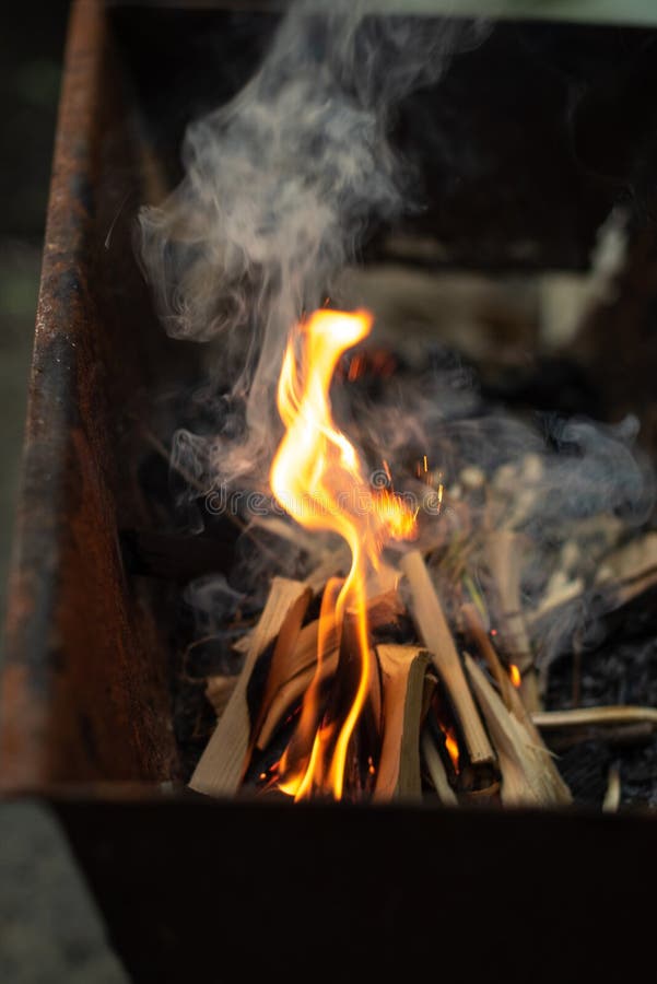 Empty Hot Charcoal Grill with a Large Flame of Fire and Smoke is ...