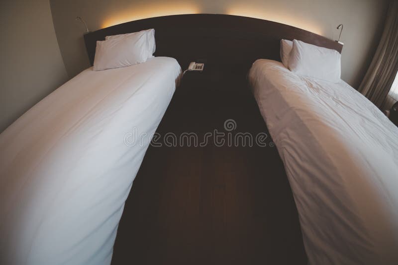 An Empty Hotel or Motel Room with Two Beds Stock Photo - Image of ...