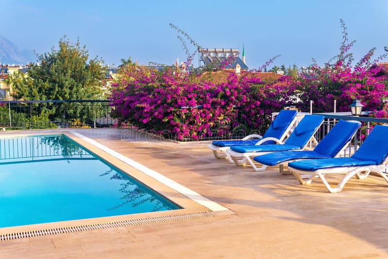 Empty Hotel with Swimming Pool and Sun Loungers Stock Photo - Image of ...