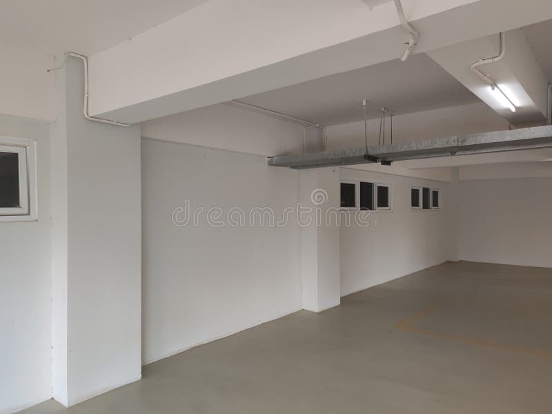 Empty Indoor Parking Area with Exposed Cable Tray Stock Image - Image ...
