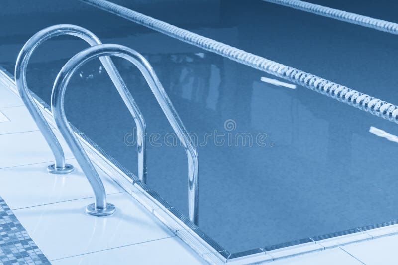 Empty Indoor Swimming Pool with Railing and Steps in Water Stock Image ...