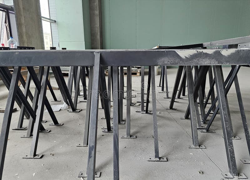 Empty Industrial Space Showcasing Collection of Metal Table Frames ...