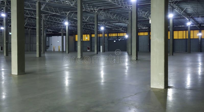 An Empty Industrial Warehouse with Large, Clean Windows, Atmospheric ...