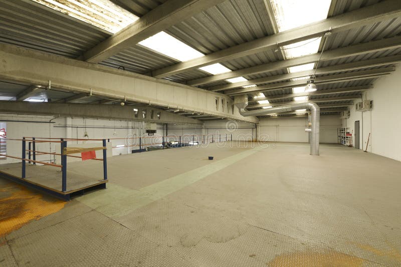 Empty Industrial Warehouse with Metal and Translucent Ceilings Combined ...