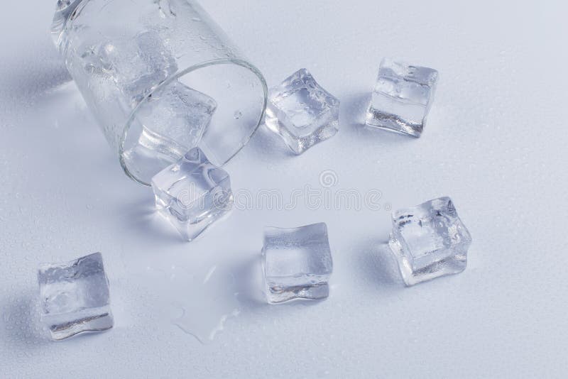 Empty Inverted Fallen Glass with Ice, on a White Background Stock Photo ...