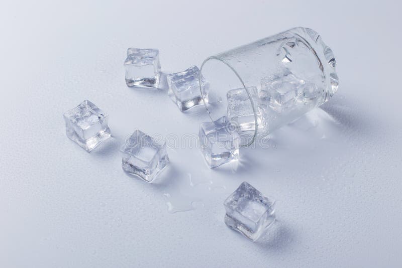 Empty Inverted Fallen Glass with Ice, on a White Background Stock Photo ...