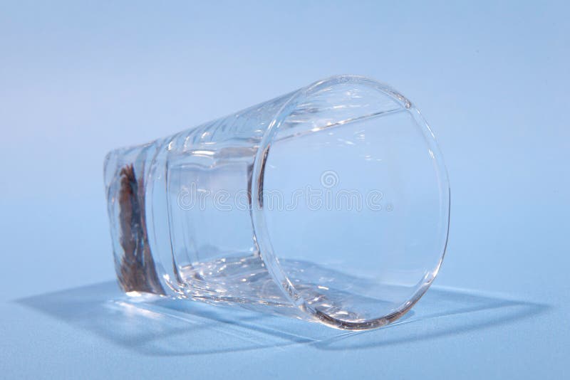 Empty Inverted Glass on Blue Background. Studio Photo Stock Photo ...