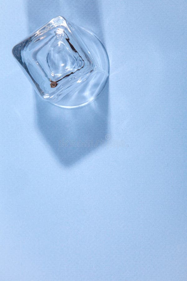 Empty Inverted Glass on Blue Background. Studio Photo Stock Photo ...