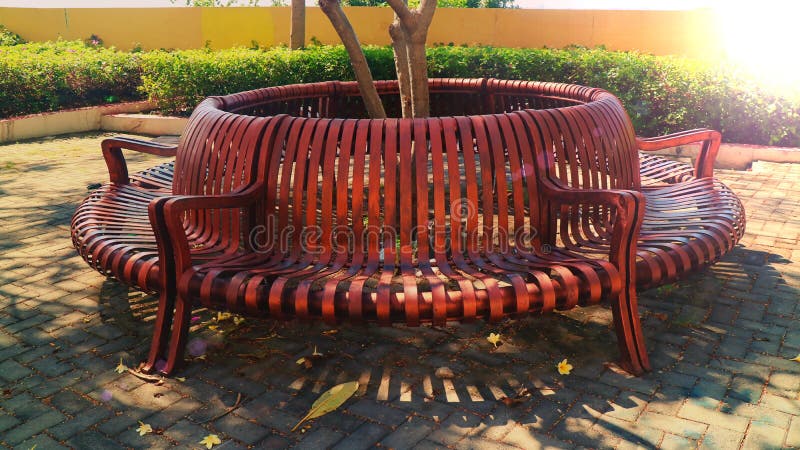 Empty iron bench in a park stock image. Image of comfort - 191598673