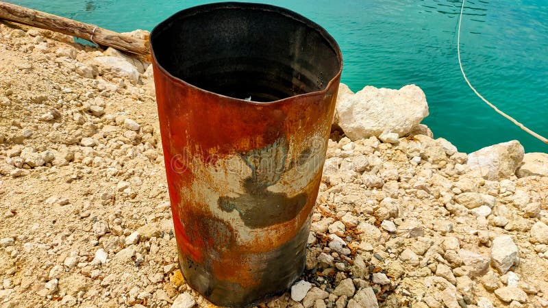 An Empty Iron Drum by the Sea Stock Photo - Image of sculpture, water ...