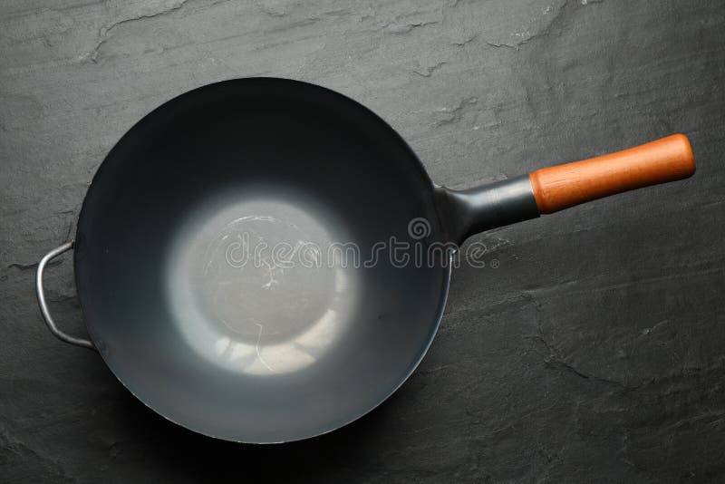 Empty Iron Wok on Black Slate Table, Top View. Chinese Cookware Stock ...
