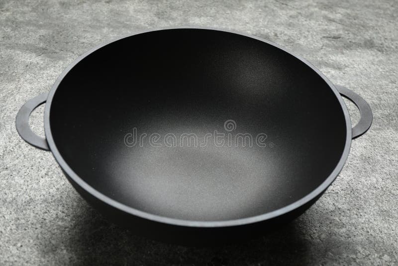 Empty Iron Wok on Grey Table. Chinese Cookware Stock Photo - Image of ...