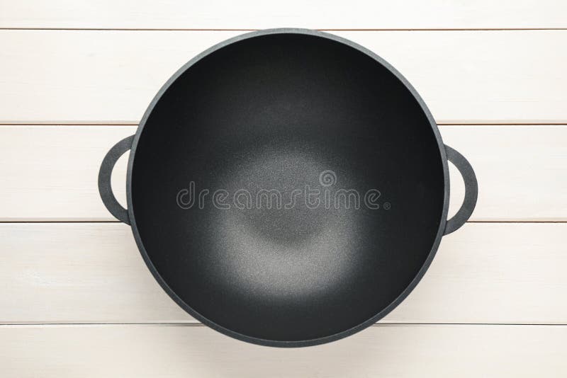 Empty Iron Wok on White Wooden Table, Top View. Chinese Cookware Stock ...