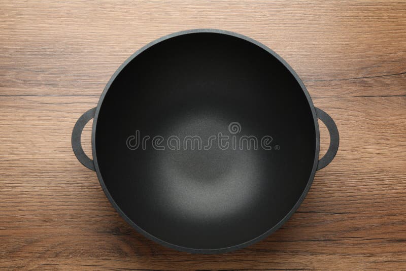 Empty Iron Wok on Wooden Table, Top View. Chinese Cookware Stock Photo ...