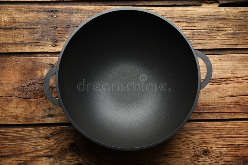 Empty Iron Wok on Wooden Table, Top View. Chinese Cookware Stock Image ...