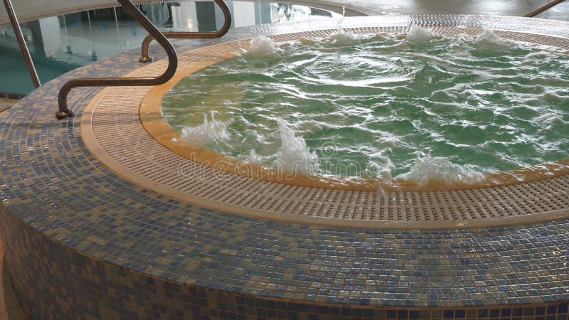 Empty Jacuzzi in Action. Spa Jacuzzi with Bubbling Water in Hotel Stock ...