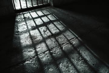 An Empty Jail Cell Captured in Black and White. Stock Photo - Image of ...