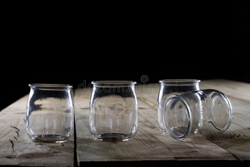Empty Jars on a Wooden Table, Black Background Stock Photo - Image of ...