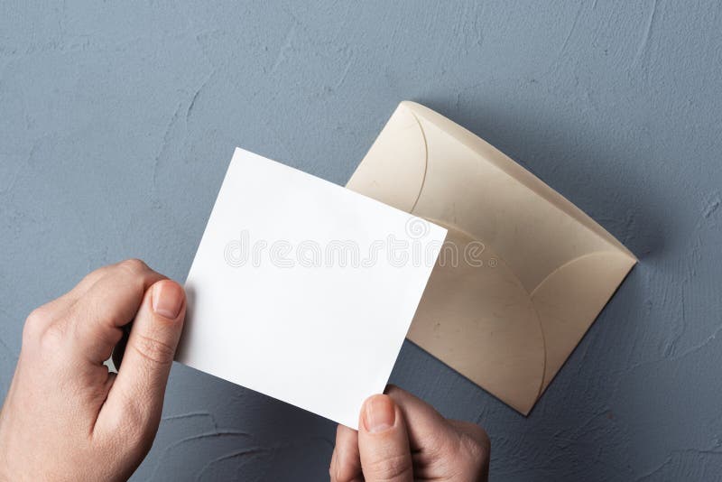 Empty Letter in Hands and an Envelope on the Table Stock Image - Image ...
