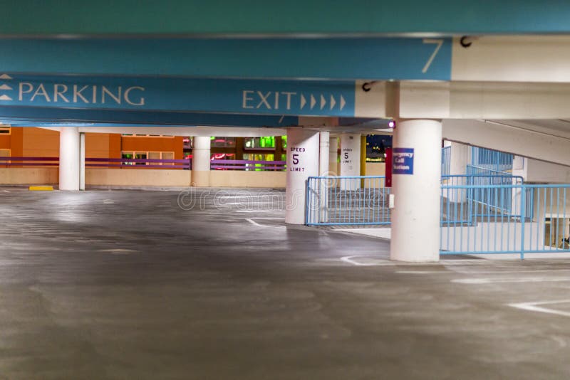 Empty Level in a Concrete Parking Garage Painted Orange and Blue Stock ...