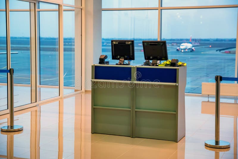 Empty Little Check-in Desks with Computers in Airport Stock Photo ...