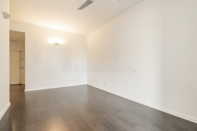 Empty Living Room with Dark Laminate Flooring and Unadorned Plain White ...