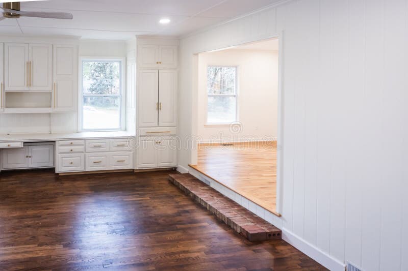 An Empty Living Room or Den Area with Built in Cabinets and Bookcases ...