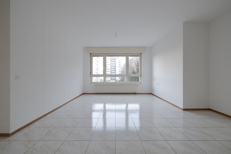 Empty Living Room with Large Bright Window with a Radiator Underneath ...