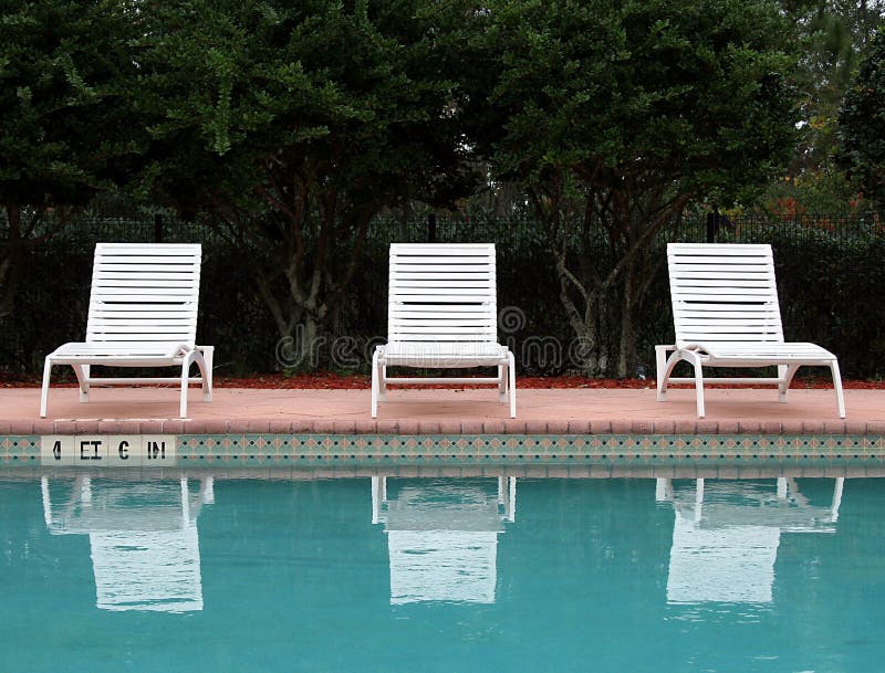 Empty Lounge chairs stock image. Image of pool, reflect - 1787195