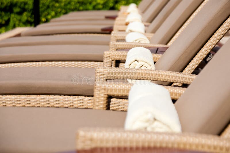 Row of Poolside Lounge Chairs Stock Image - Image of tropical, deck ...