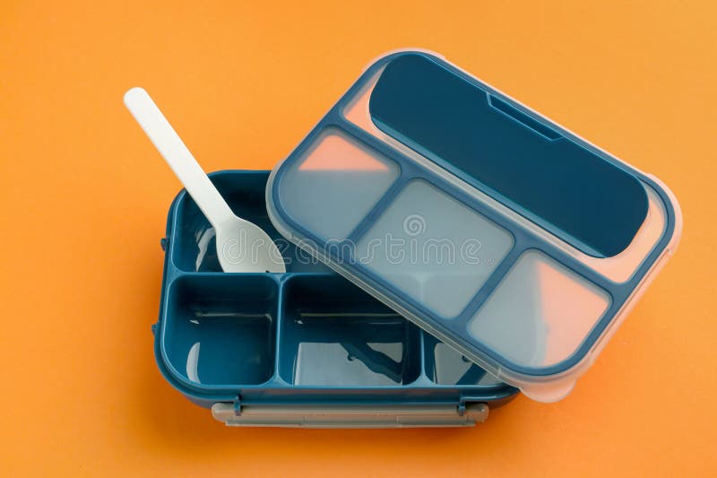Empty Lunch Box and Fork on Orange Background, Above View Stock Image ...
